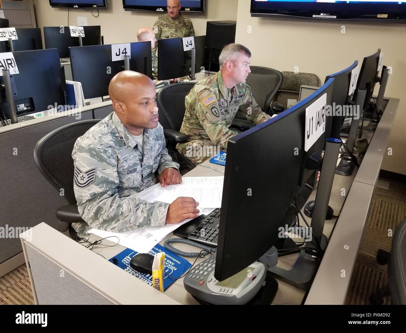 Tech. Sgt. Anthony Cherry, left, and Staff Sgt. Philip Wallace manage ...