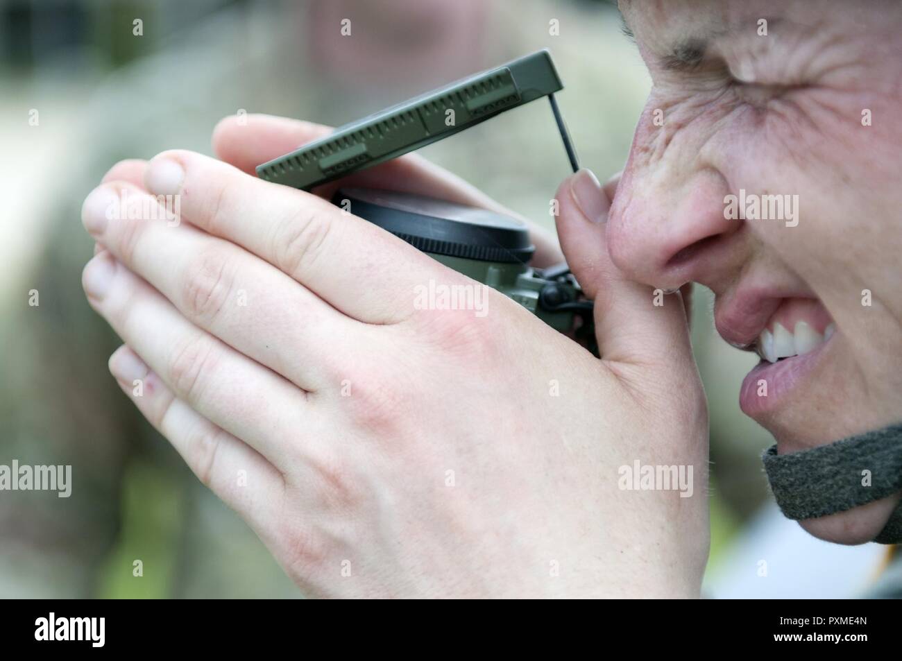 A Warrior uses a compass to plot coordinates during the combat skills ...