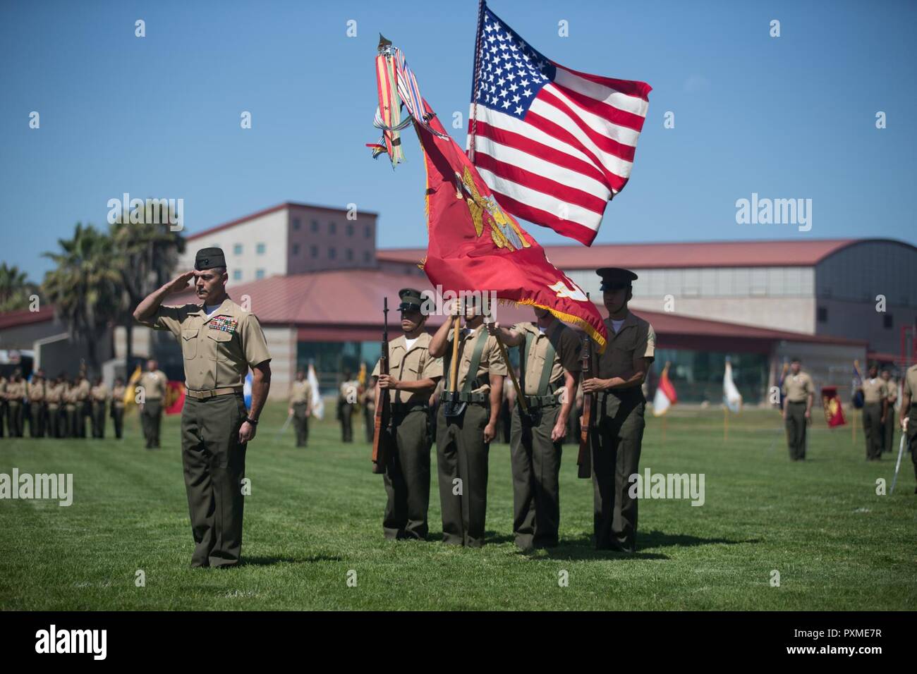 U.S. Marine Col. Phillip N. Frietze renders honors during the national ...