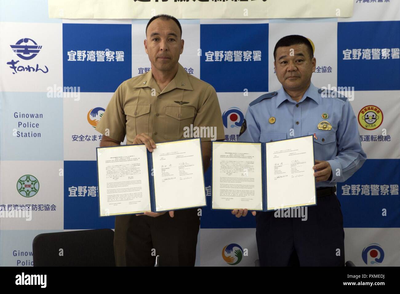 GINOWAN, OKINAWA, Japan— Col. Peter Lee, left, and Ginowan Police Chief ...