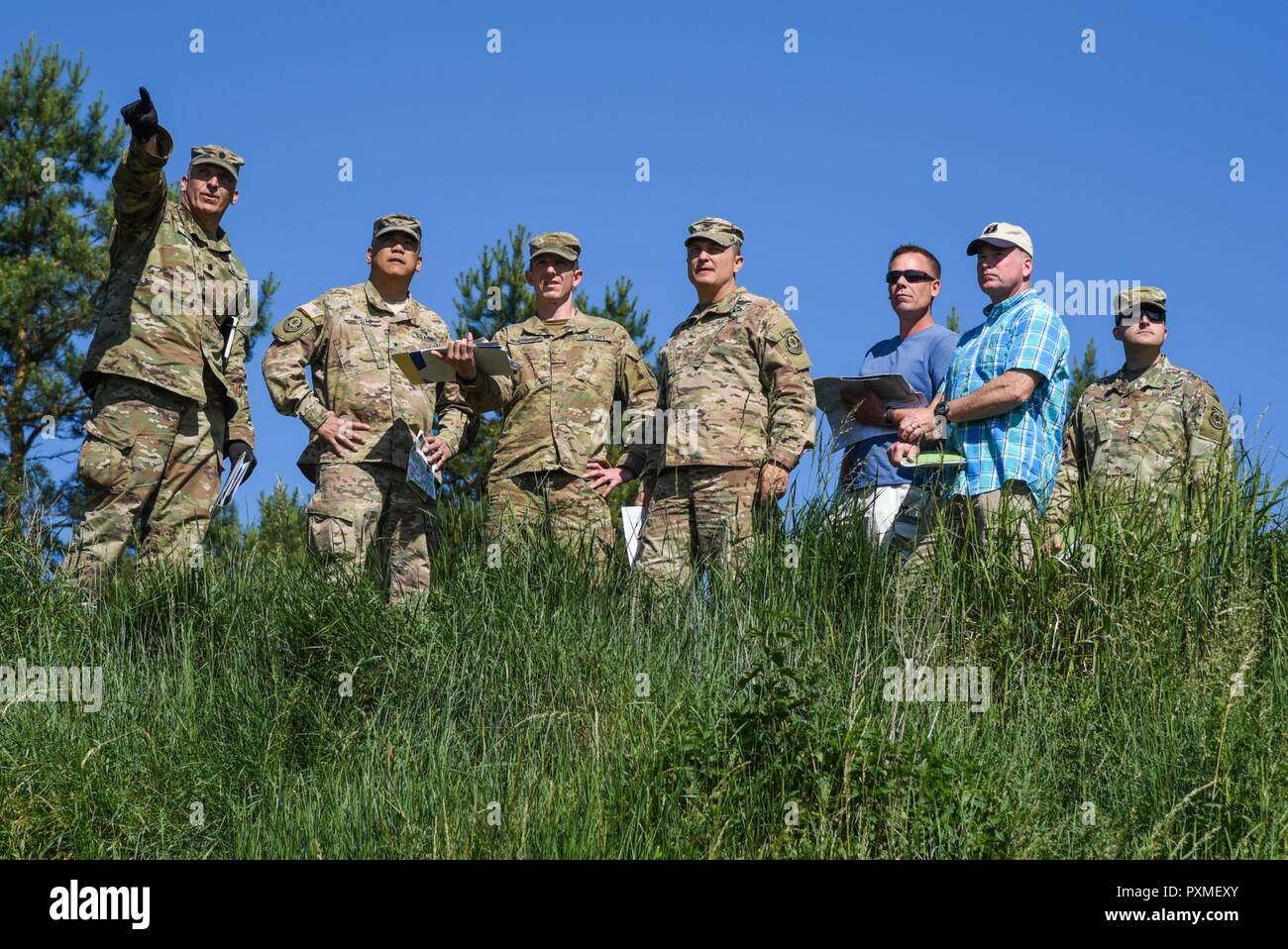 U.S. Army Brig. Gen. Tony Aguto, second from left, Commanding General ...