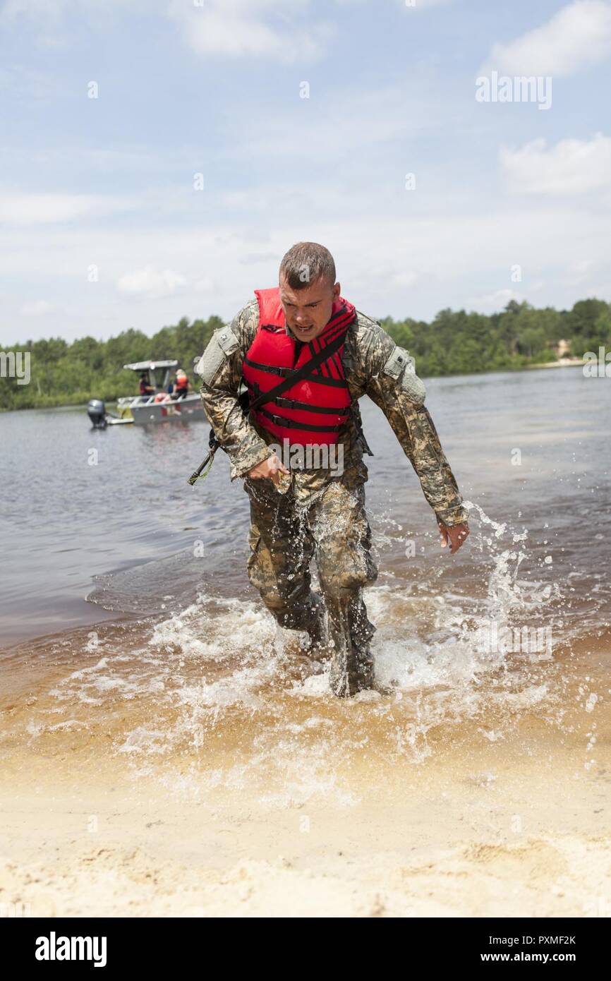 Sgt. Benjamin Poulin, 824th Transportation Company, finishes a 300 ...