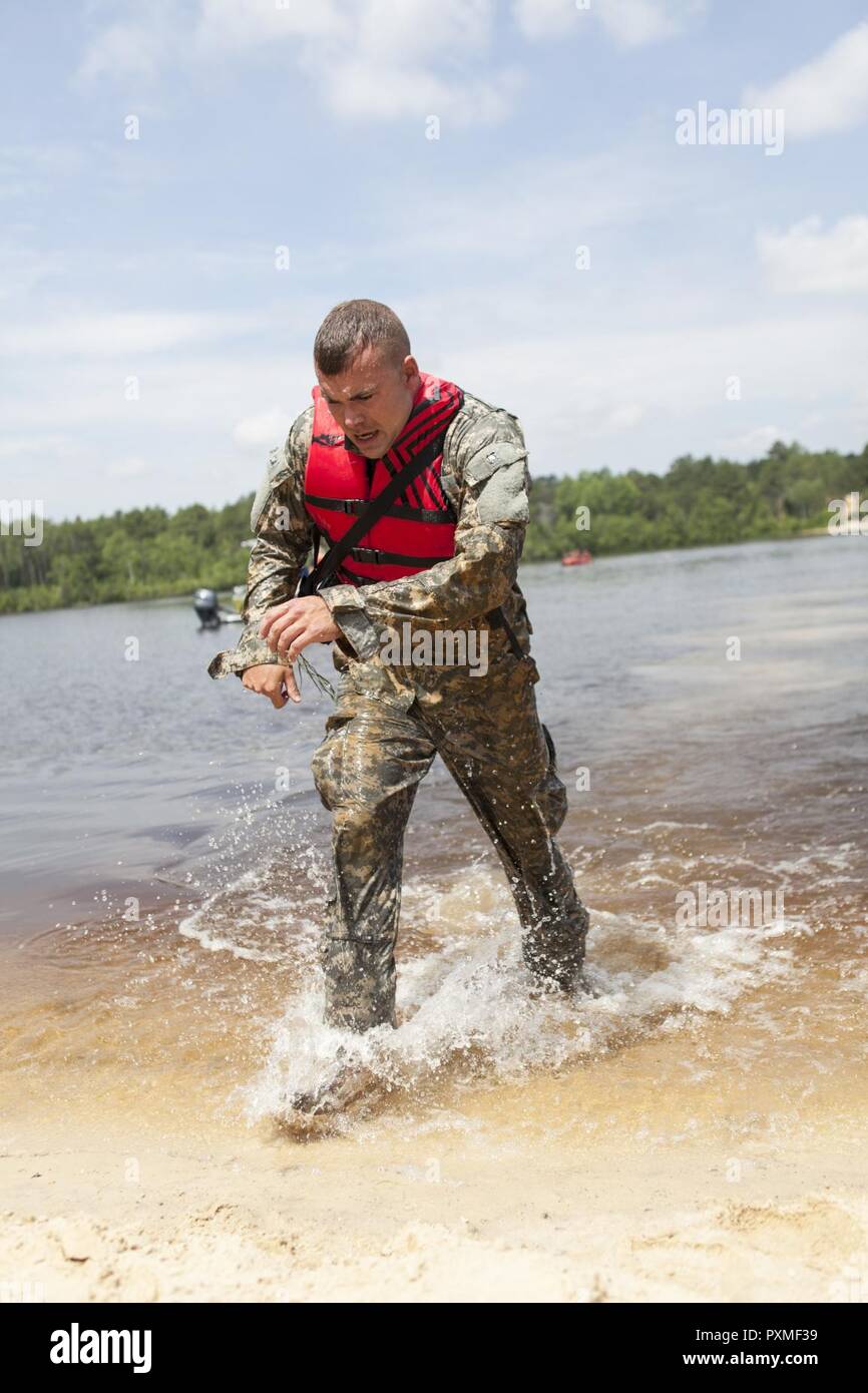 Sgt. Benjamin Poulin, 824th Transportation Company, finishes a 300 ...
