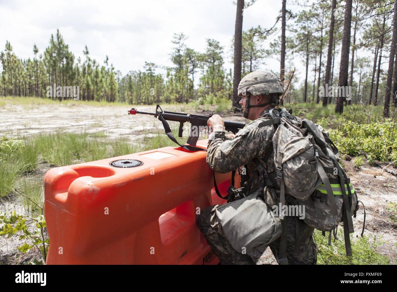 Sgt. Benjamin Poulin, 824th Transportation Company, cover fire during a ...