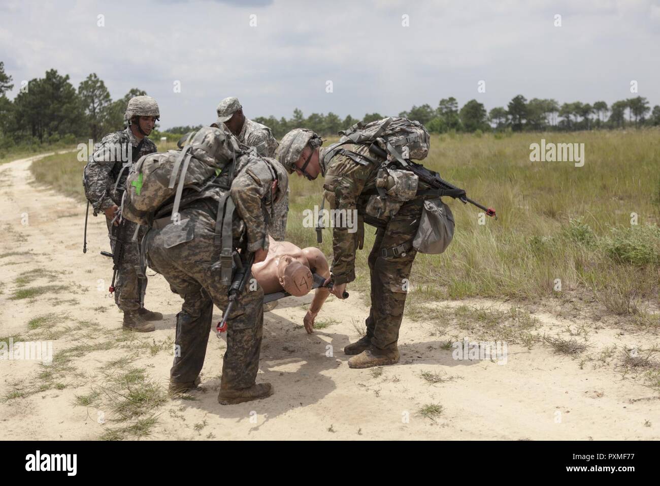 Warriors conduct a 4-man carry on a simulated Soldier during a mystery ...