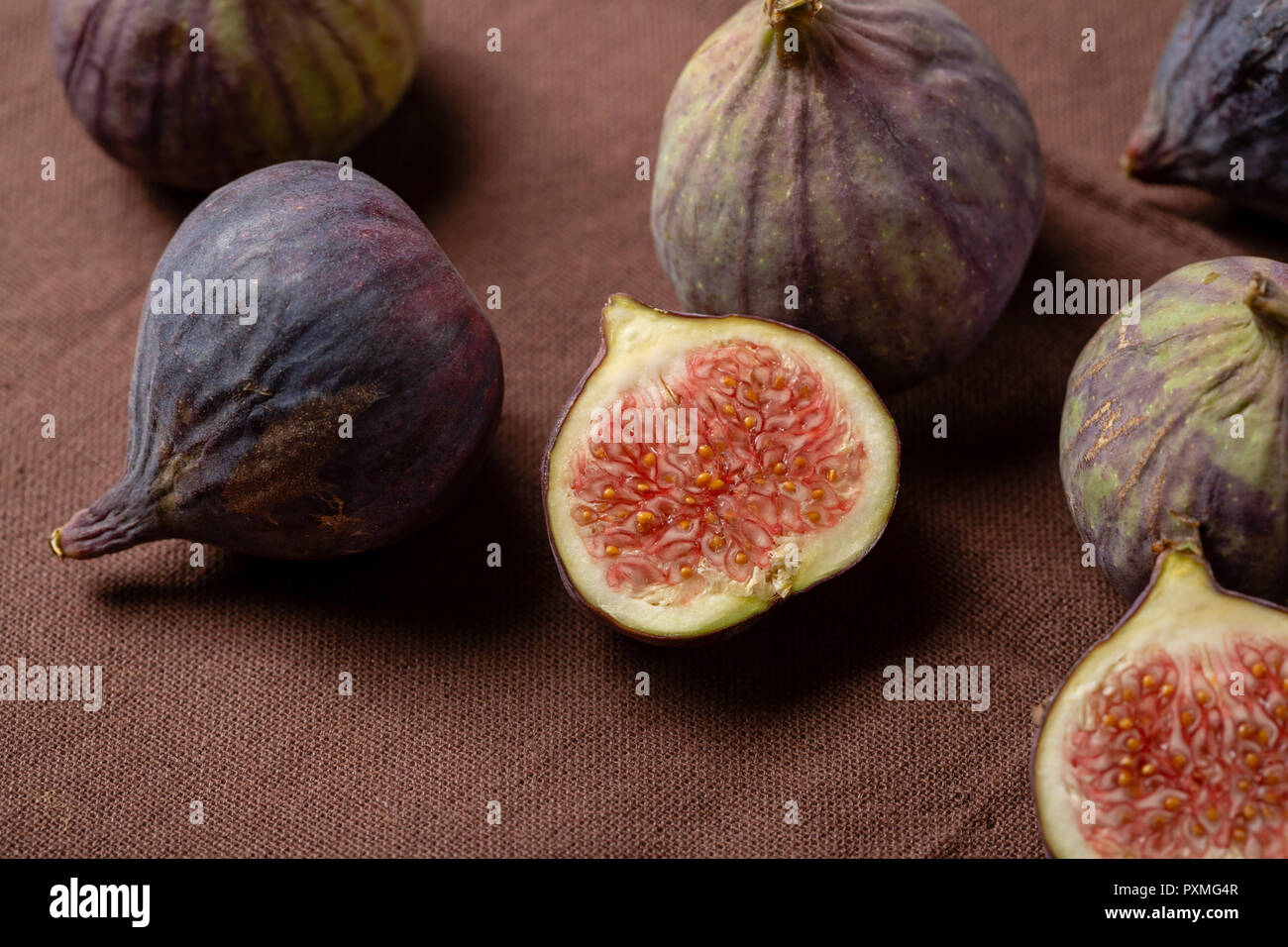 Fresh figs on brown backdrop Stock Photo - Alamy