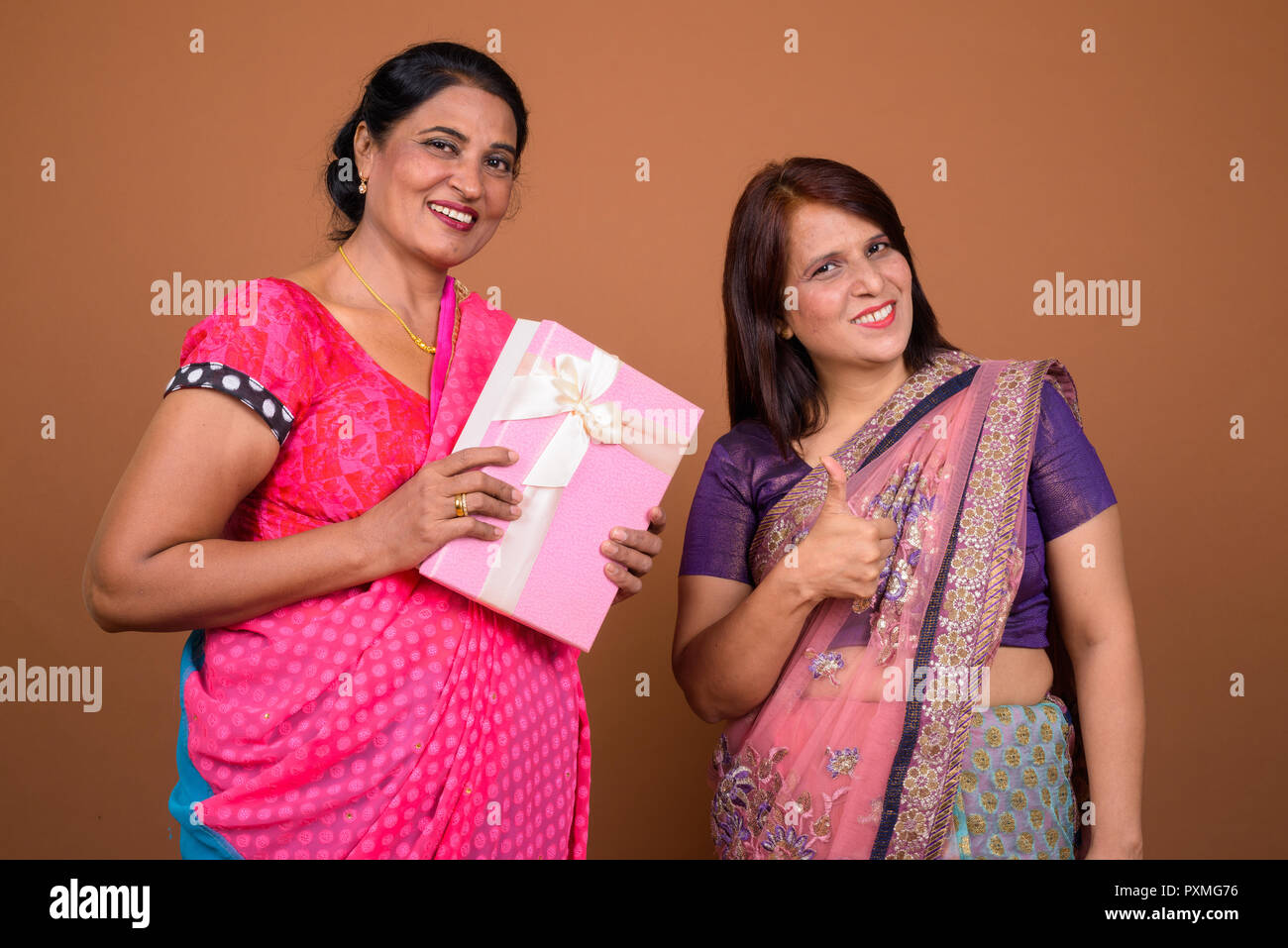 Woman not impressed with present hi-res stock photography and images ...