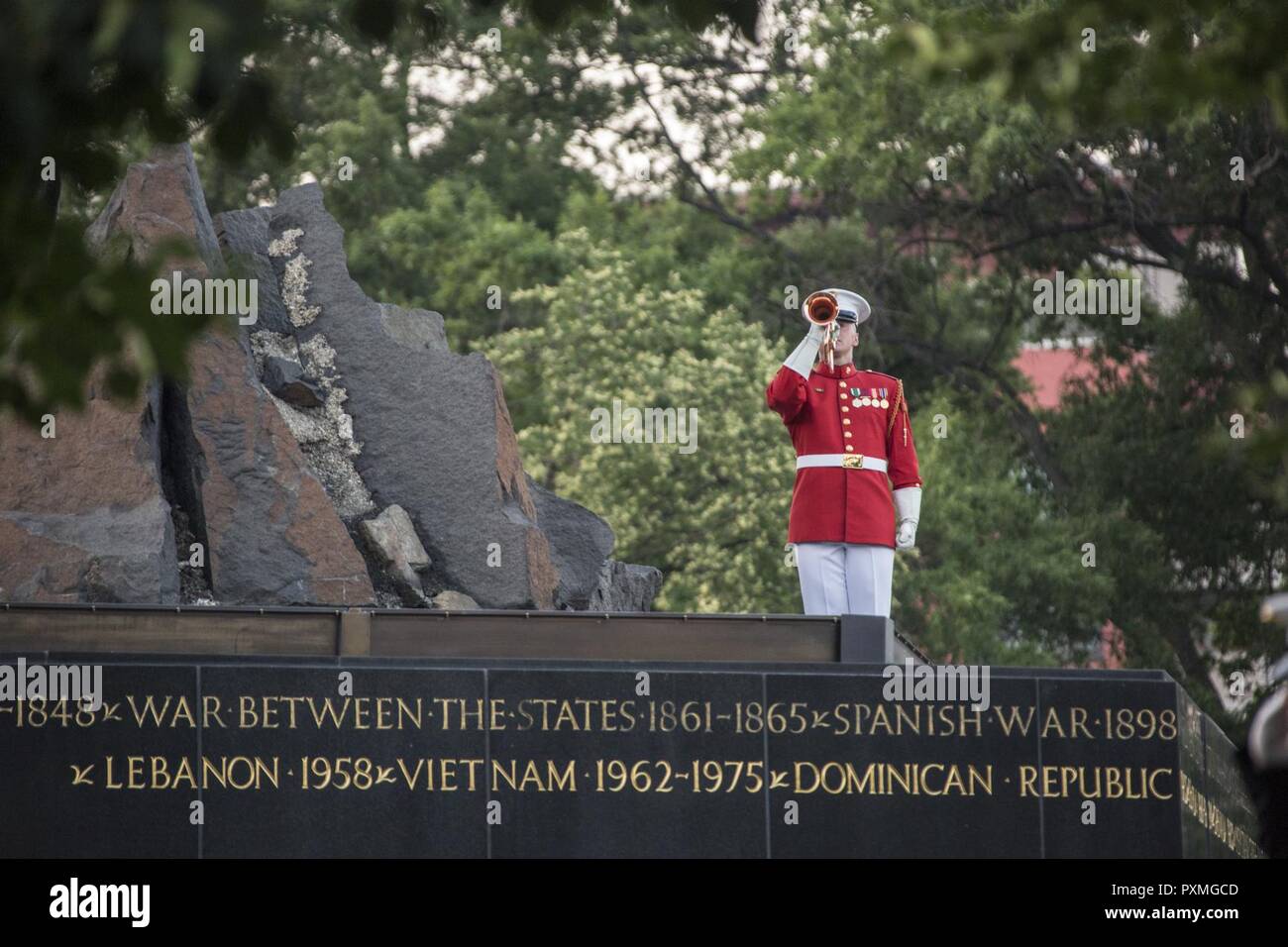 A ceremonial bugler with the Marine Corps Drum and Bugle Corps performs ...