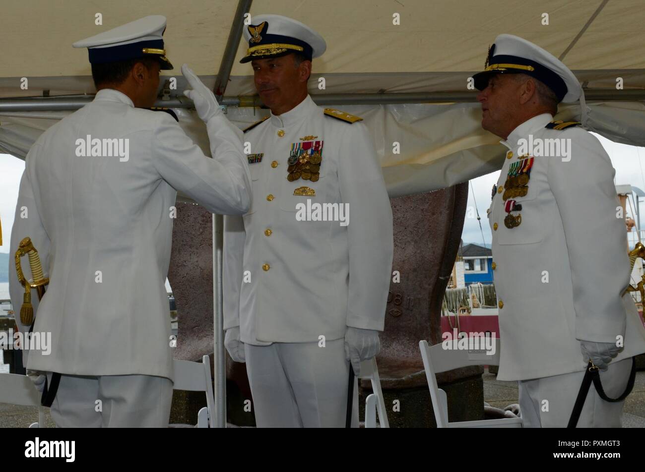 Cmdr. Alain Balmaceda salutes Rear Adm. Pat DeQuattro, deputy commander ...