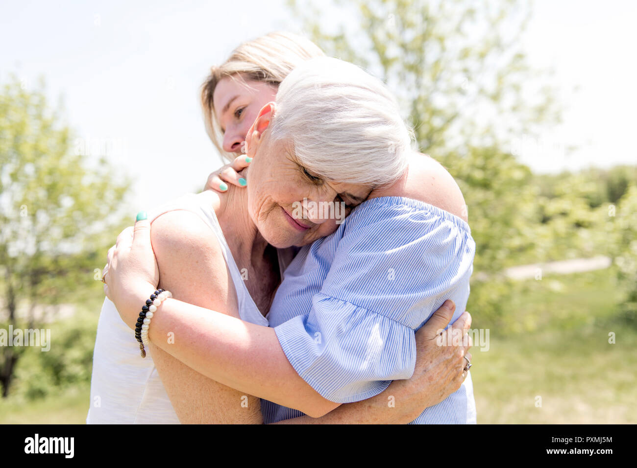Elderly man and daughter consoling hi-res stock photography and images ...