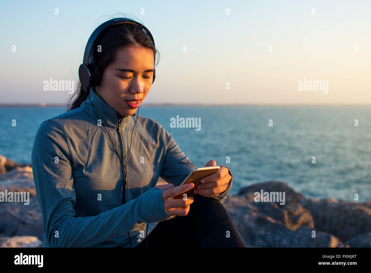 Happy asian woman listen music hi-res stock photography and images - Alamy
