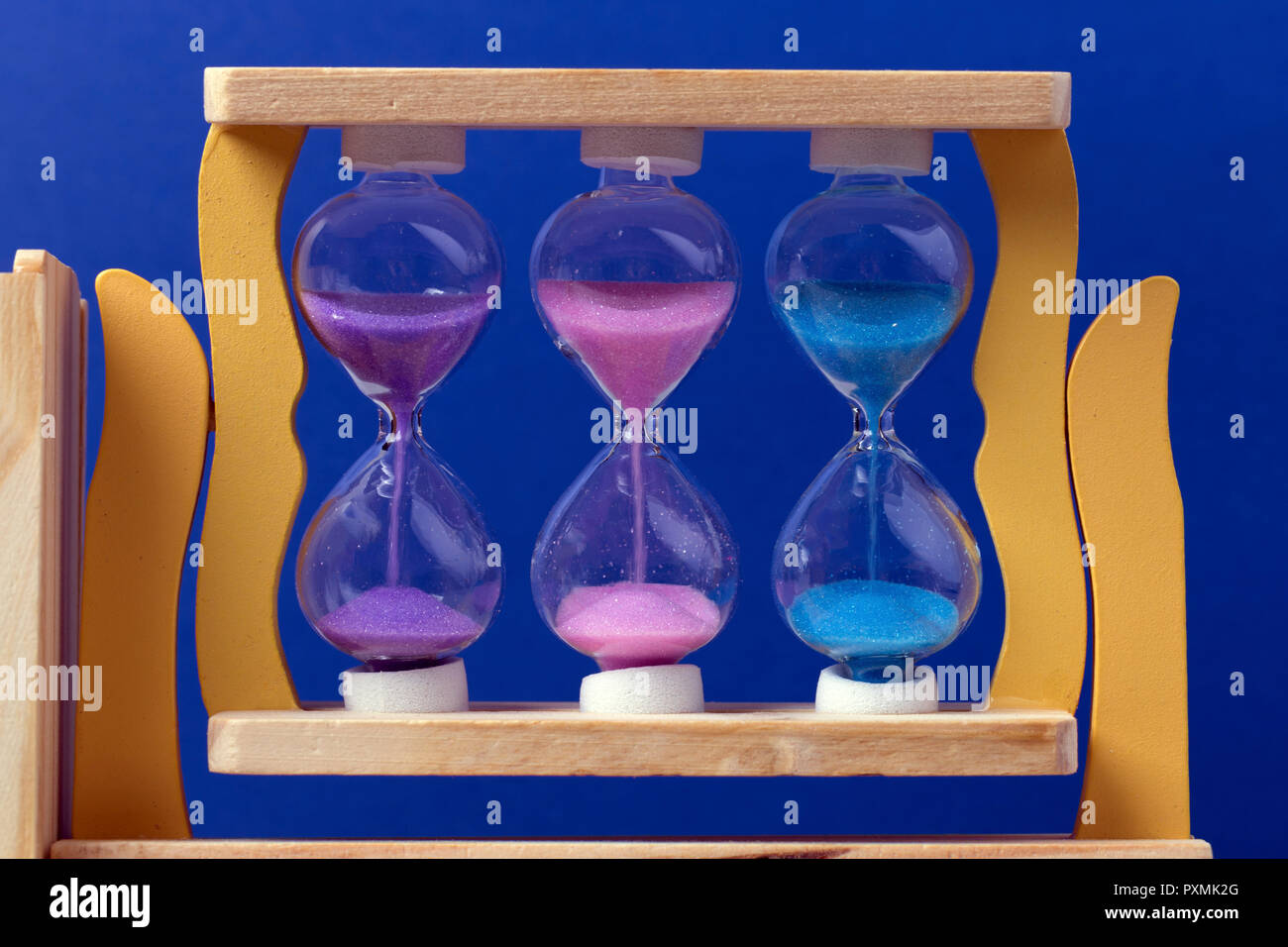 Shiny hourglass on blue background hi-res stock photography and images ...