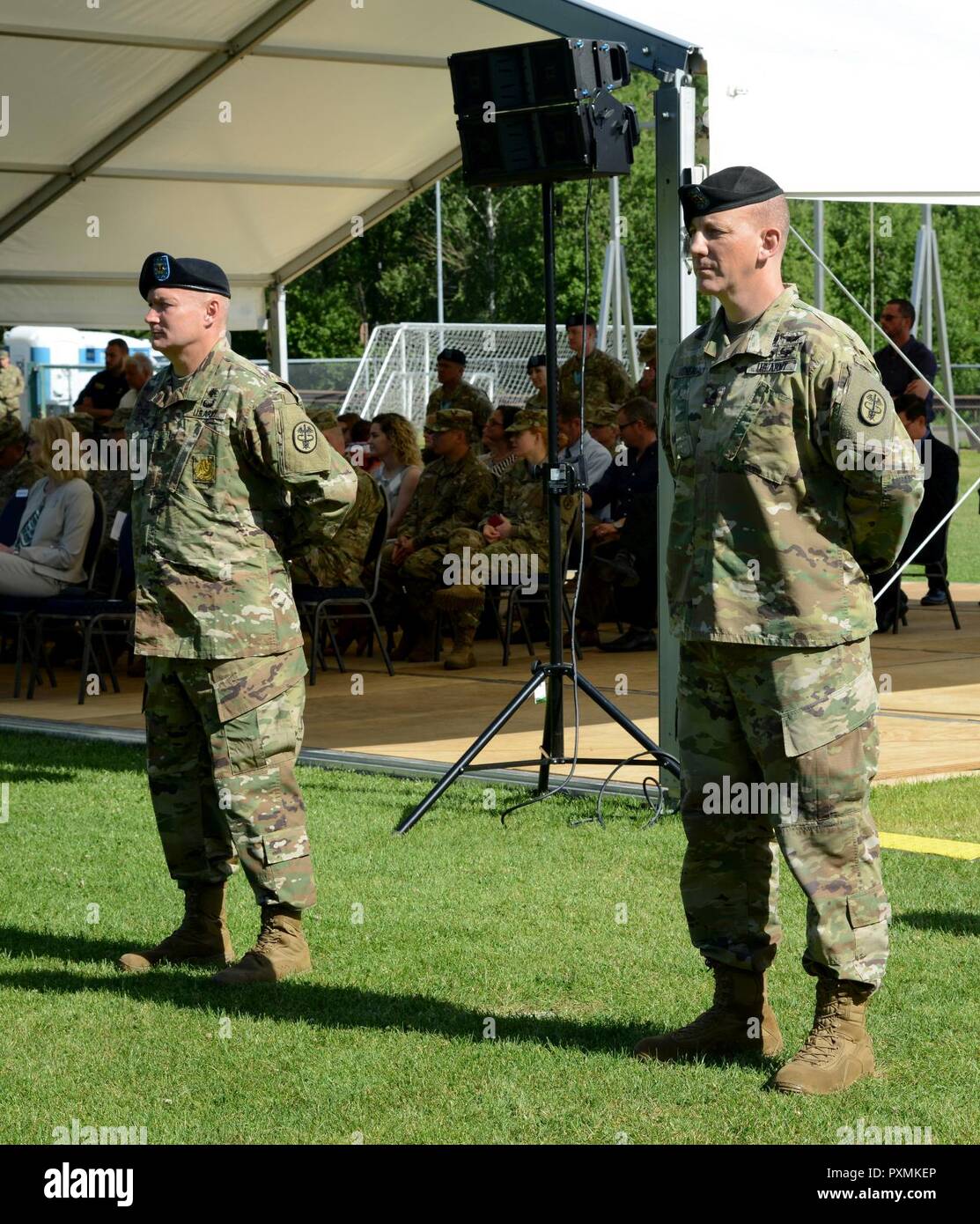 The incoming and outgoing command sergeants major stand and wait for ...