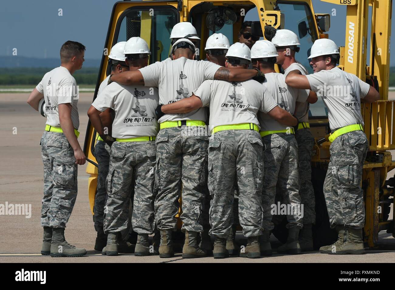 U.S. Air Force Airmen from the 7th Munitions Squadron, construct a ...