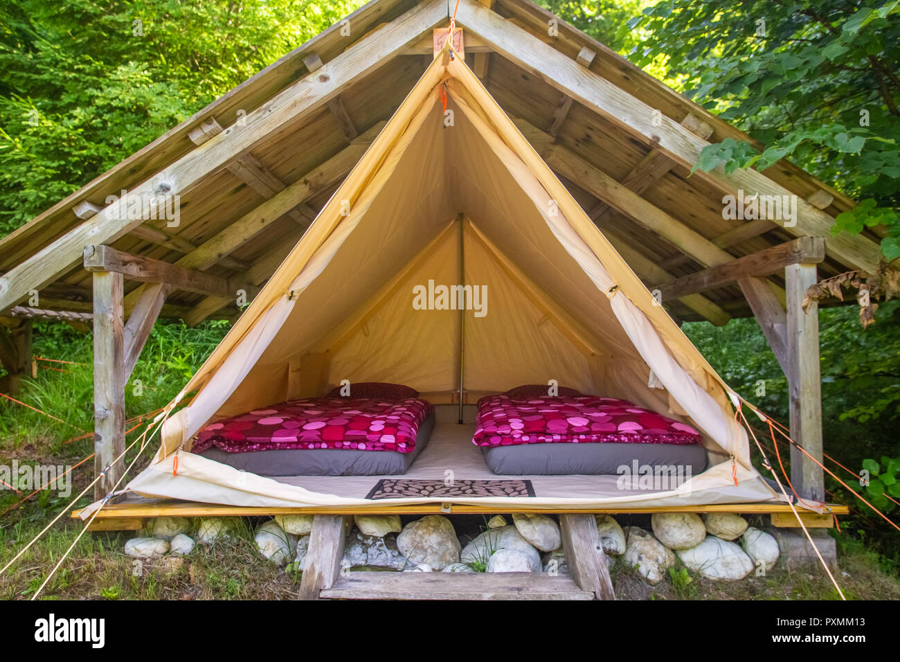 Cute fabric tents protected by wooden huts in Adrenaline Check eco camp ...