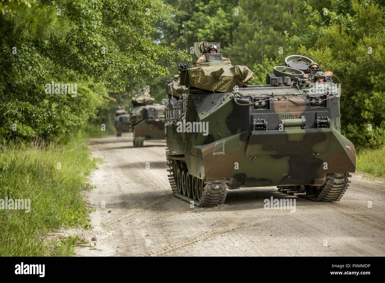 Marines make their way to the water in amphibious assault vehicles at ...