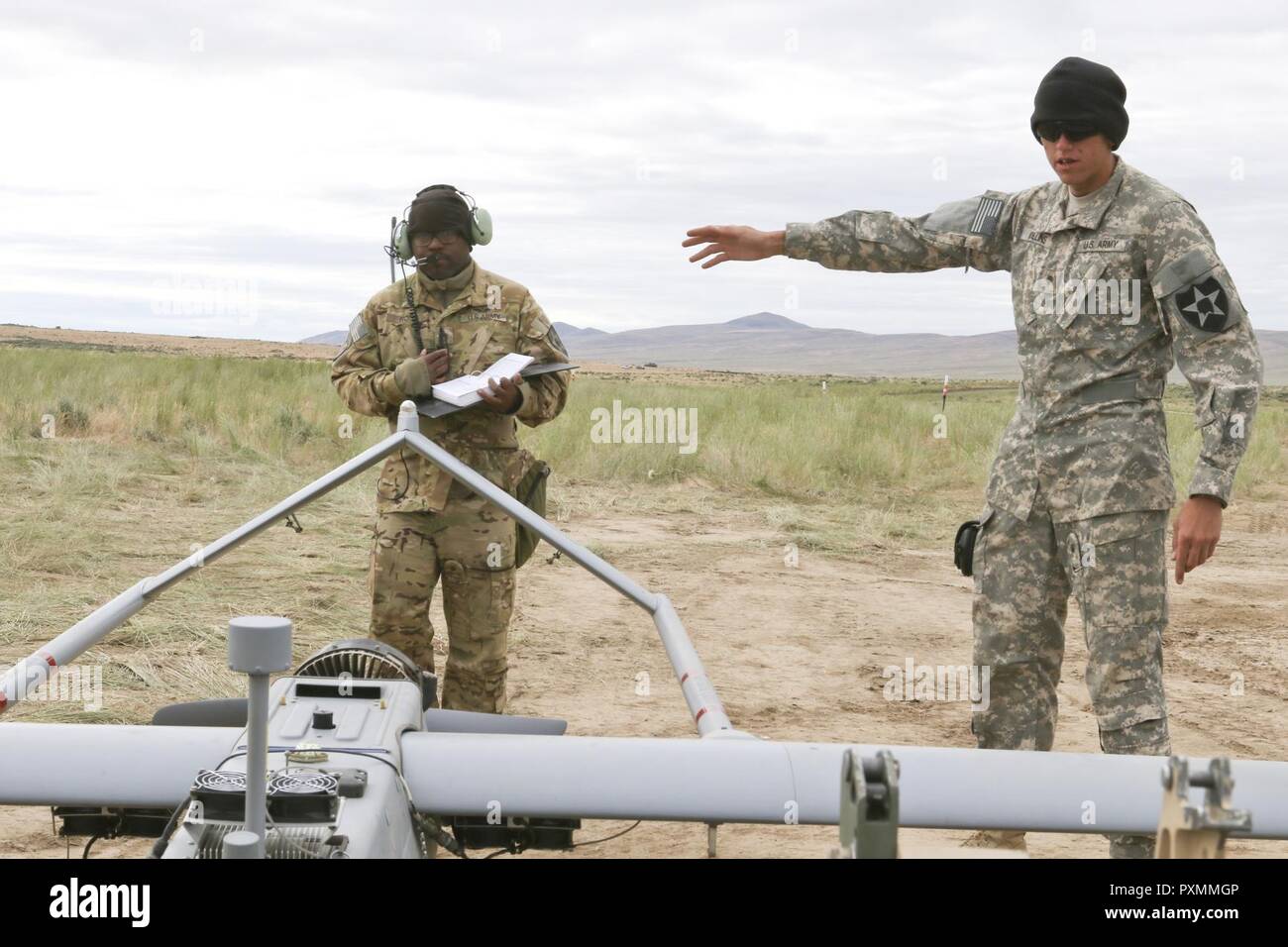 Spc. Joshua Collins (right), an Unmanned Aerial System Maintainer with ...