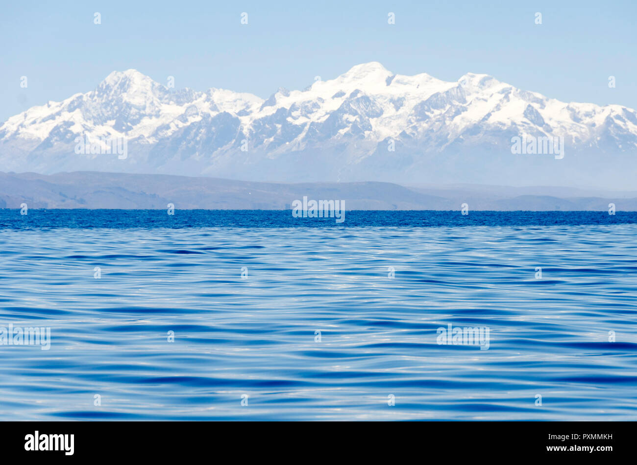 Snow covered Andes mountains, looking across Lake Titicaca, near Isla ...