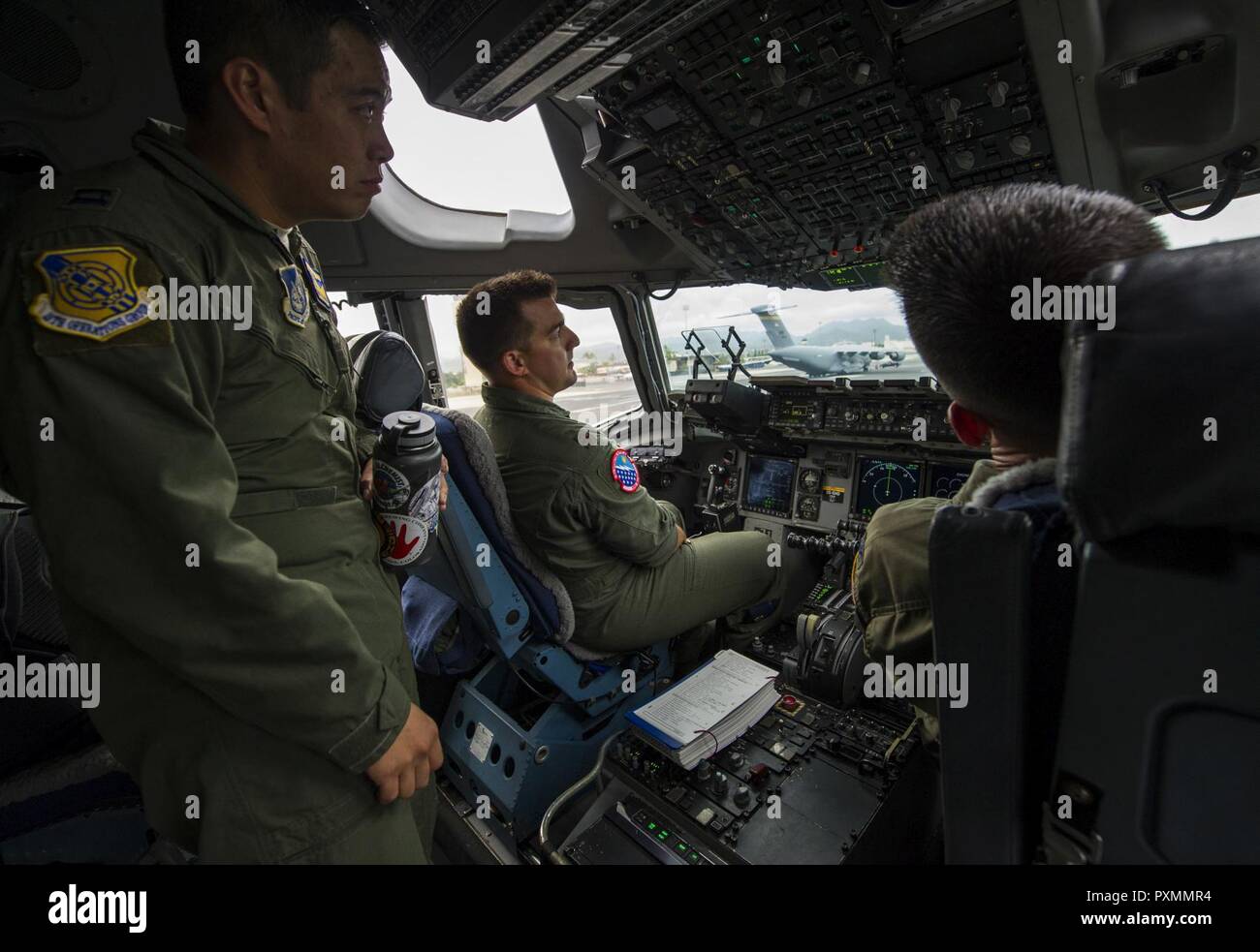 Col. Charles Velino, 15th Operations Group commander, Maj. Justin ...