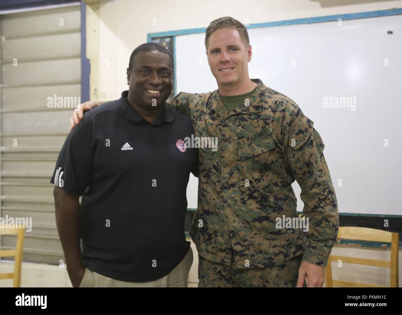 U.S. Marine Sgt. Mike Meehan poses with Anthony Creece, his former ...