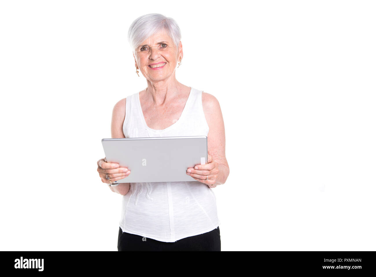 elderly woman on studio white background holding laptop Stock Photo - Alamy