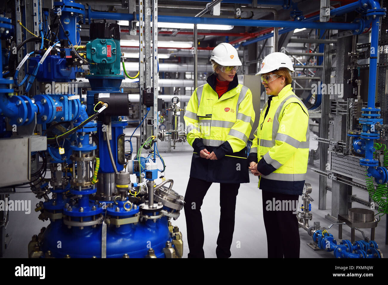 First Minister Nicola Sturgeon (right) talks with GlaxoSmithKline's ...