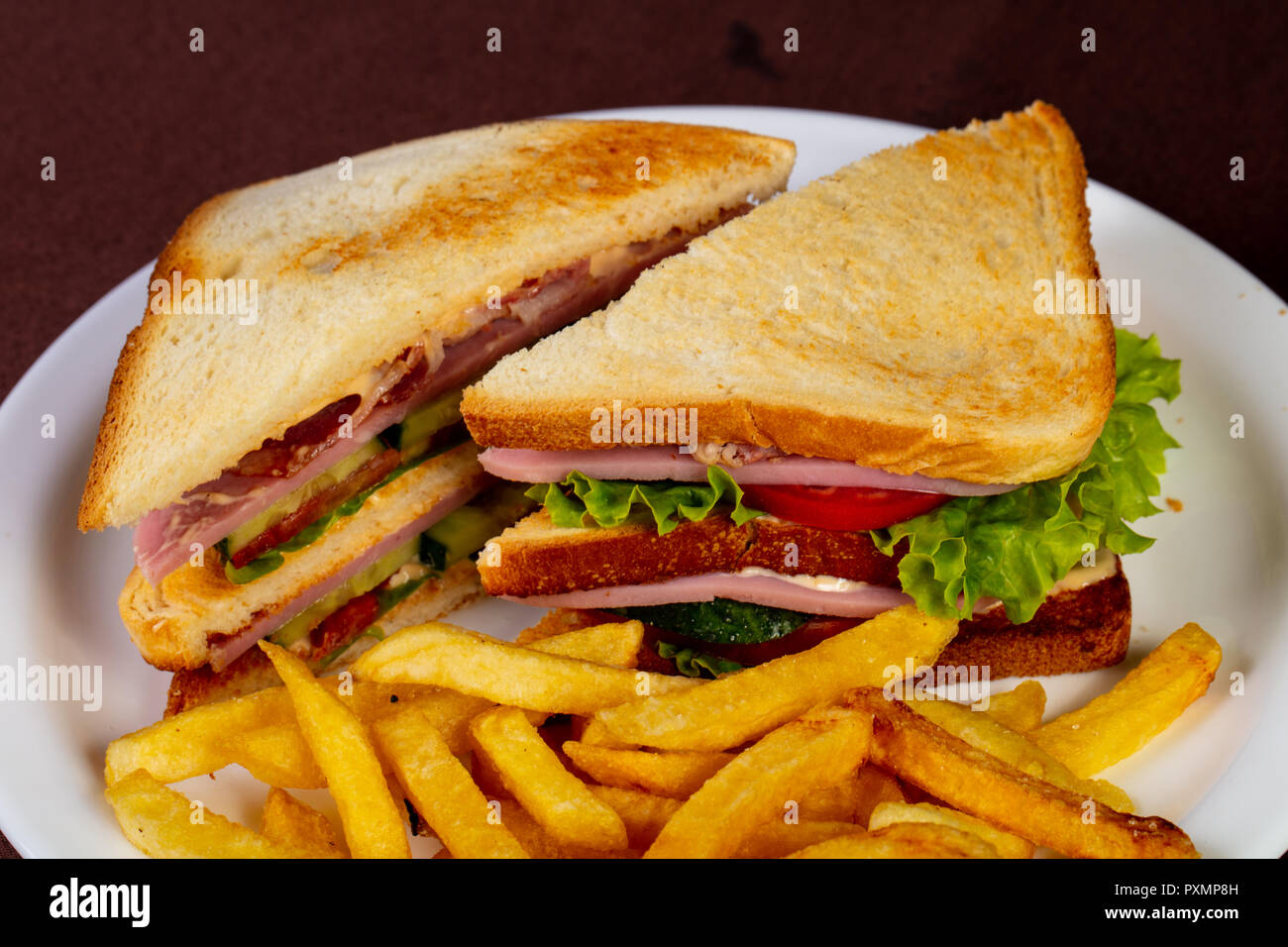 Club sandwich with ham and cheese Stock Photo - Alamy