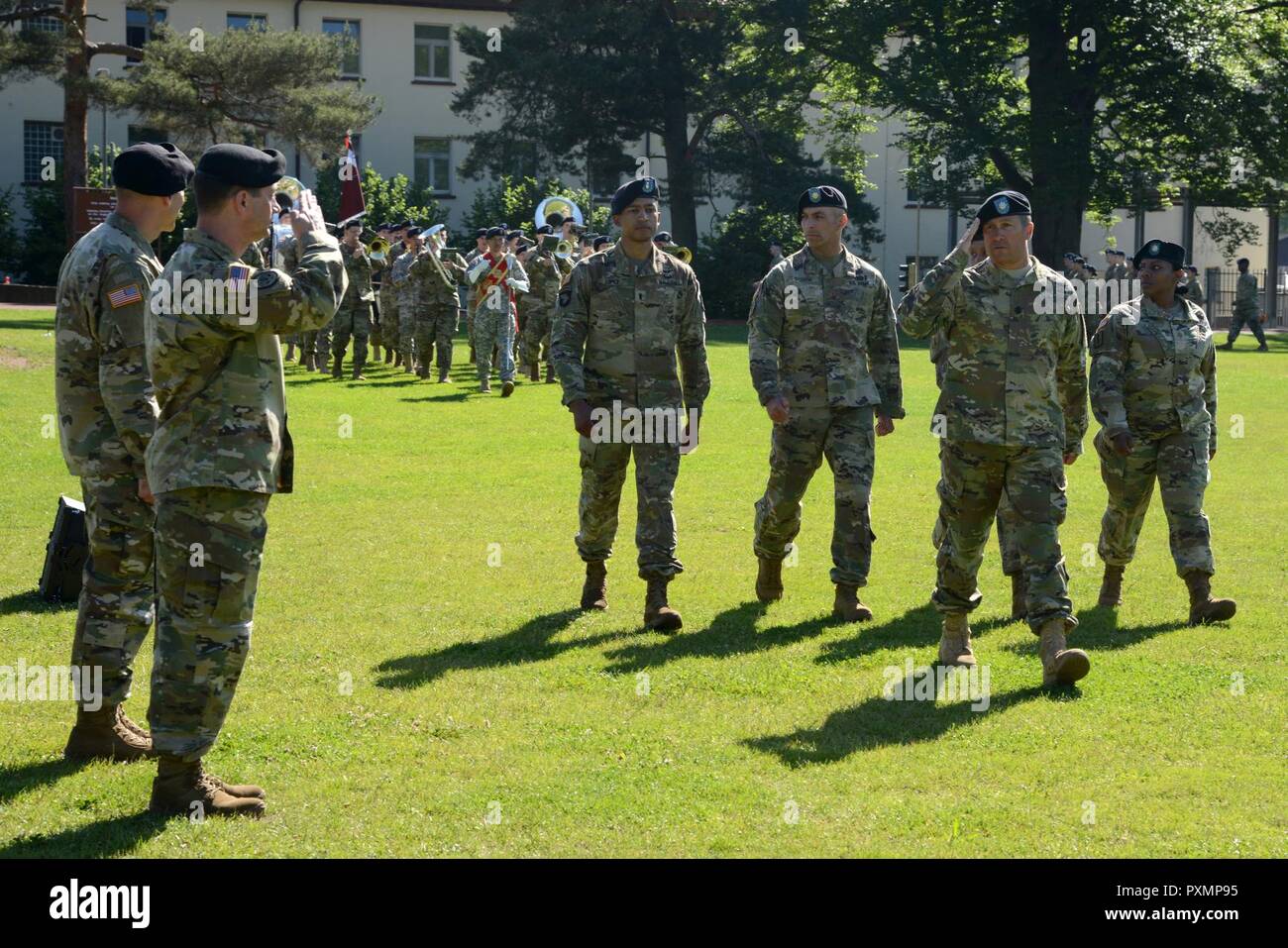 Lt. Col. Kyle Patterson, commander of troops salutes during pass in ...