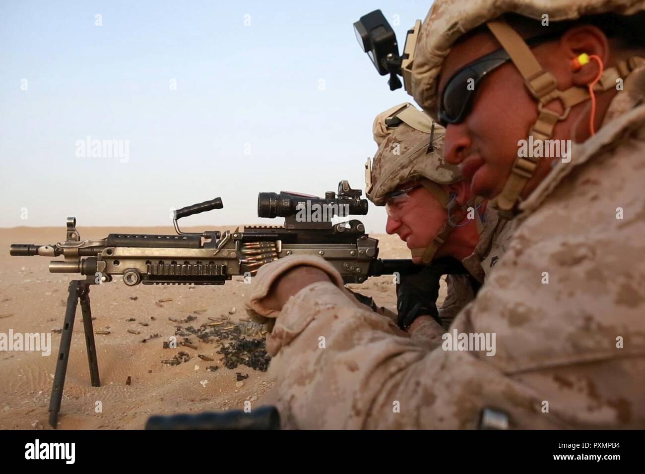 U.S. Marine Corps Lance Cpl. Kervin B. JeaneClaude, a machine gunner ...