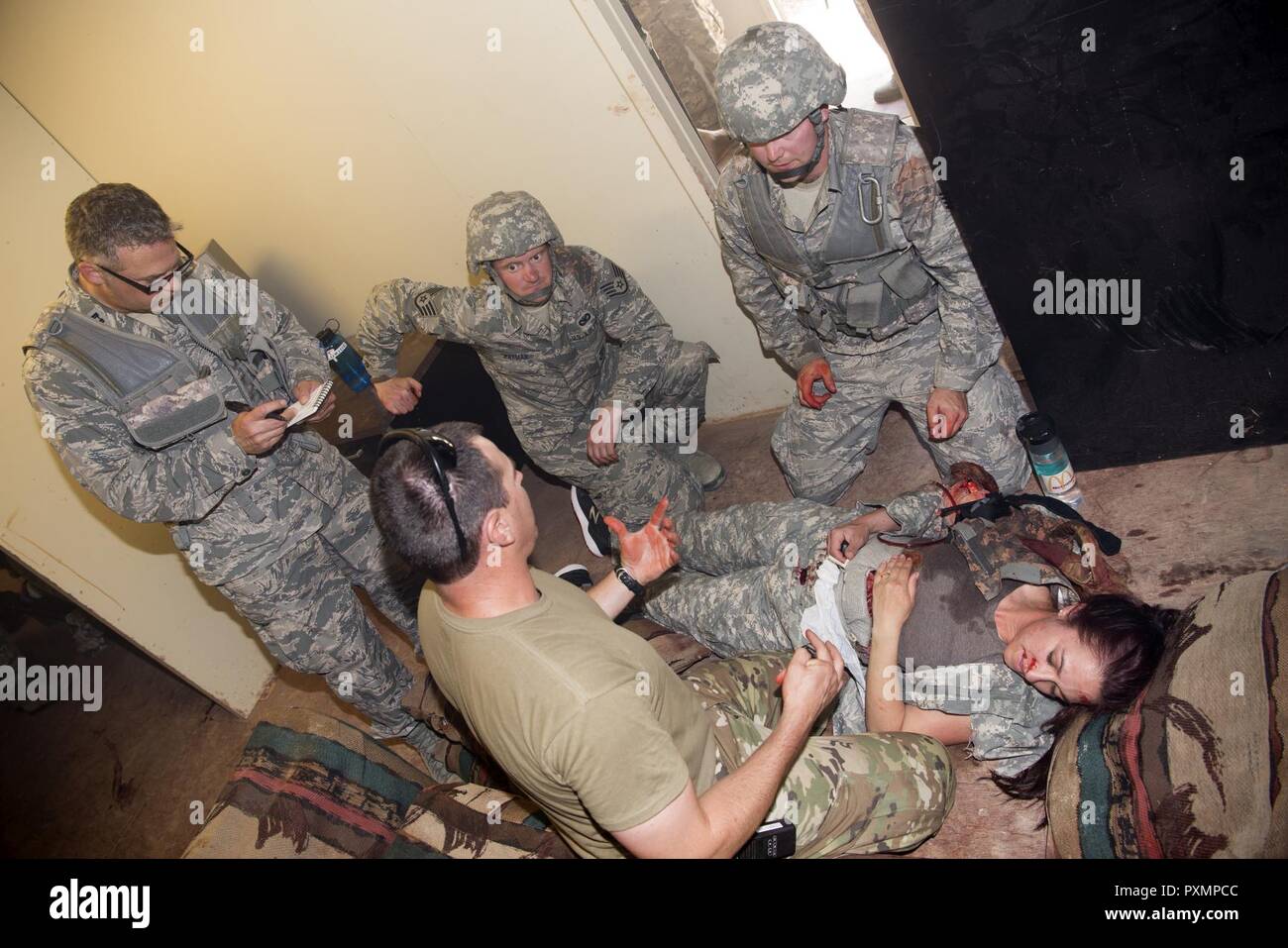 Army Sergeant Rob McKay, 10th Special Forces Group Medic (kneeling ...