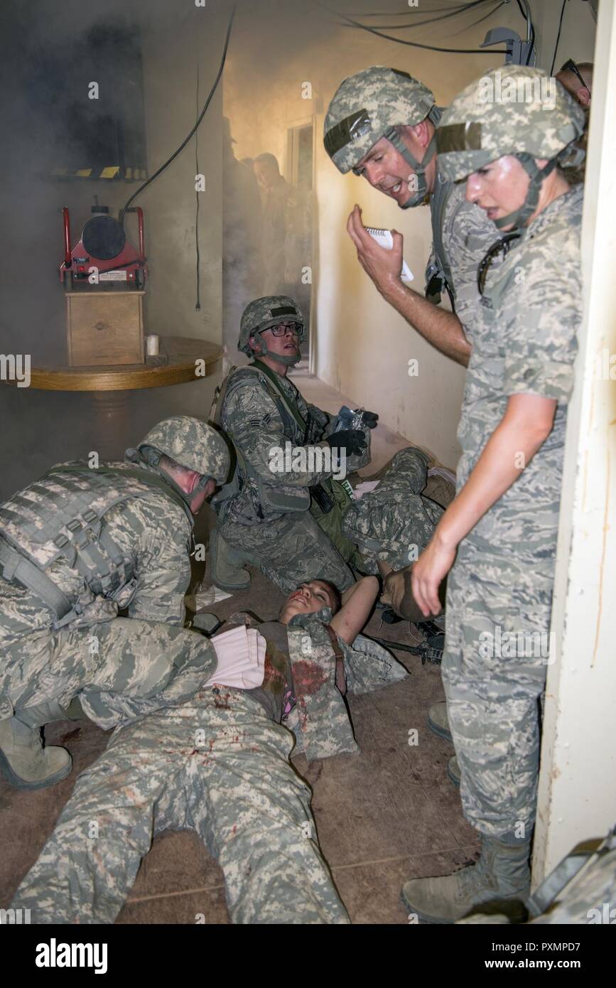 Capt. Amber Knuthson (right), Lt Dustin Munroe, and Senior Airman Al ...