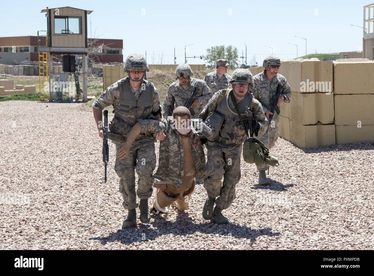 Members from the 233d Space Group carry a simulated casualty to an ...