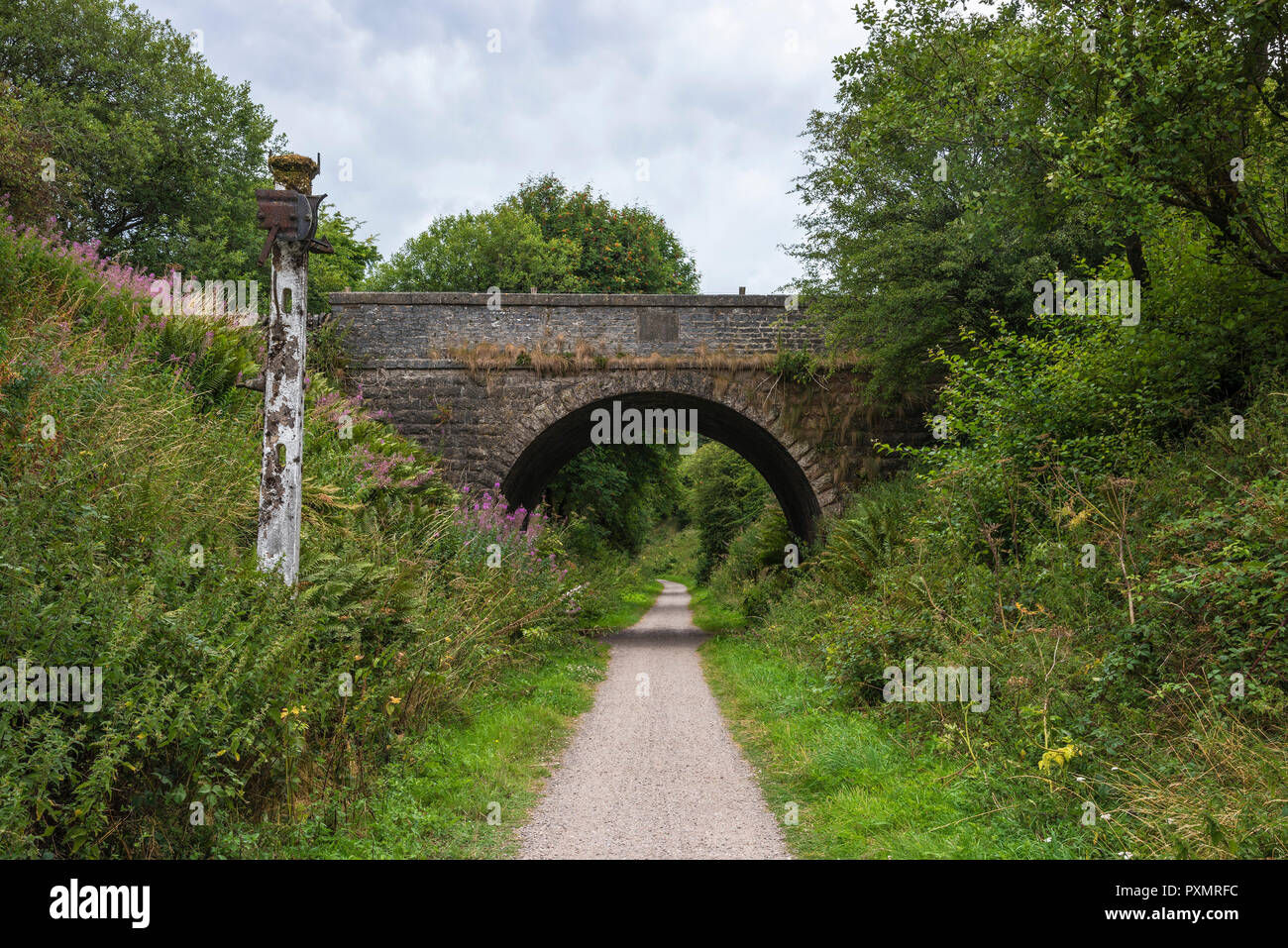 Part of the old Tissington Trail passing under an old bridge just ...