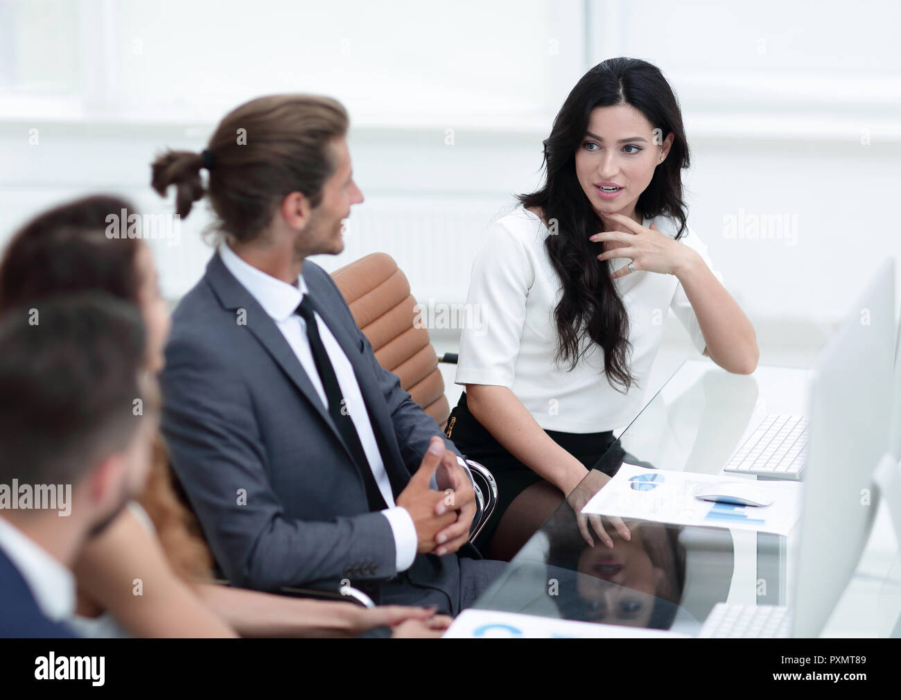 business people communicate at work their Desk Stock Photo - Alamy