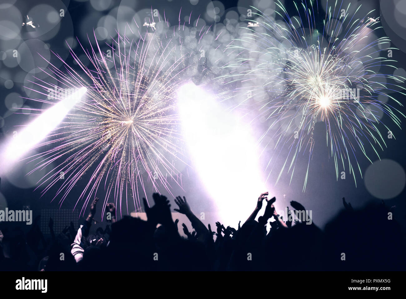 New Year concept with cheering crowd and fireworks Stock Photo - Alamy