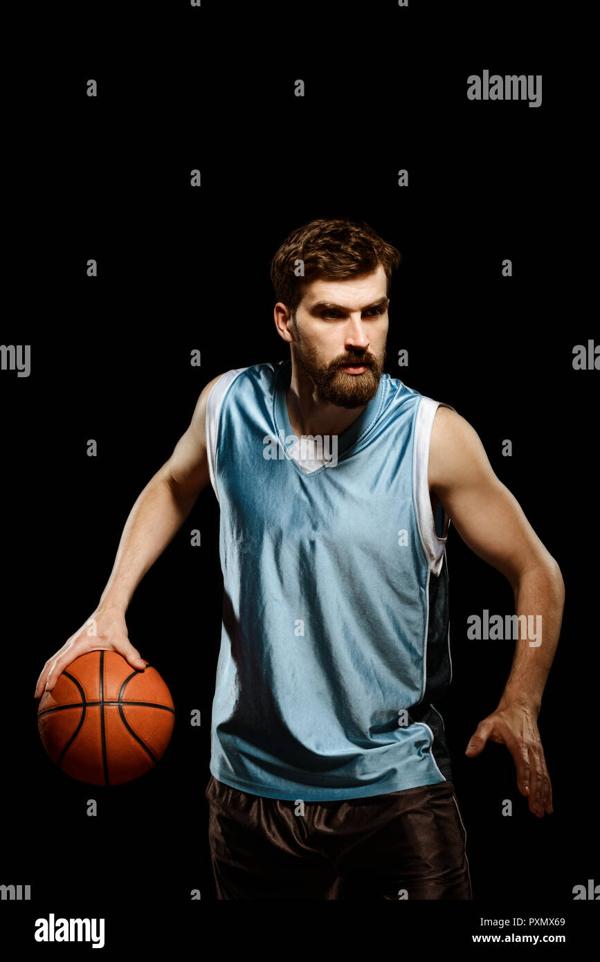 Basketball player in blue uniform Stock Photo - Alamy