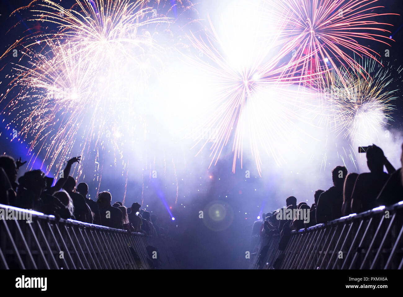 New Year concept with cheering crowd and fireworks Stock Photo - Alamy