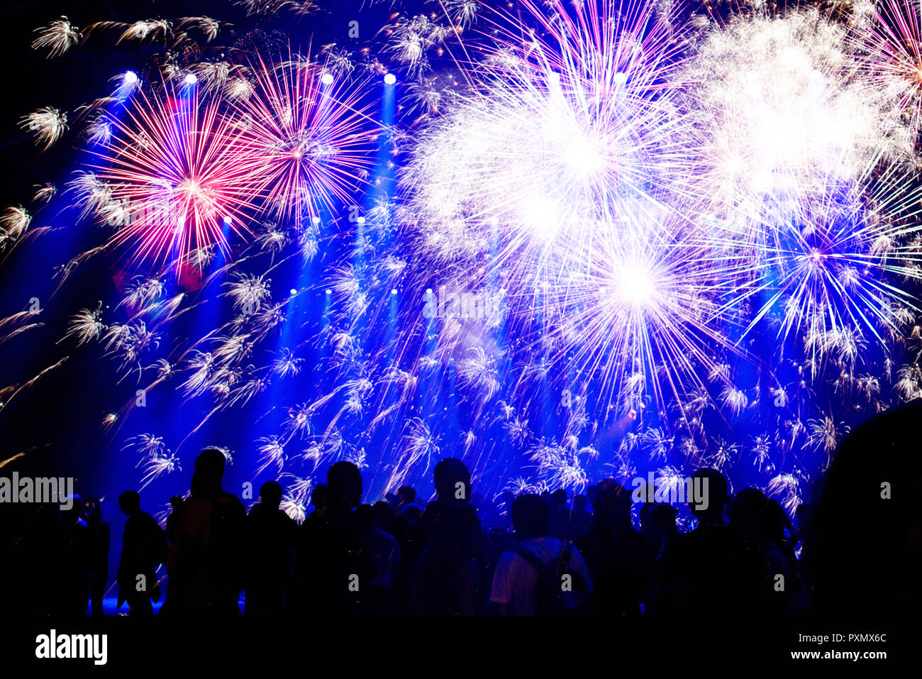 New Year concept with cheering crowd and fireworks Stock Photo - Alamy