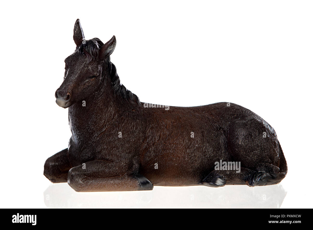 Figure of a mule for the Nativity Potal isolated on a white background ...