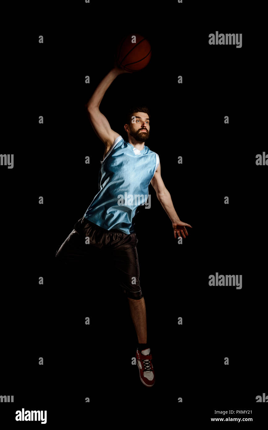 Basketball player is throwing a ball hi-res stock photography and ...