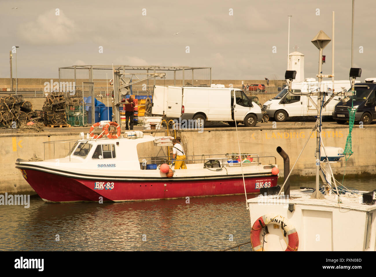Unloading fish boxes hi-res stock photography and images - Alamy