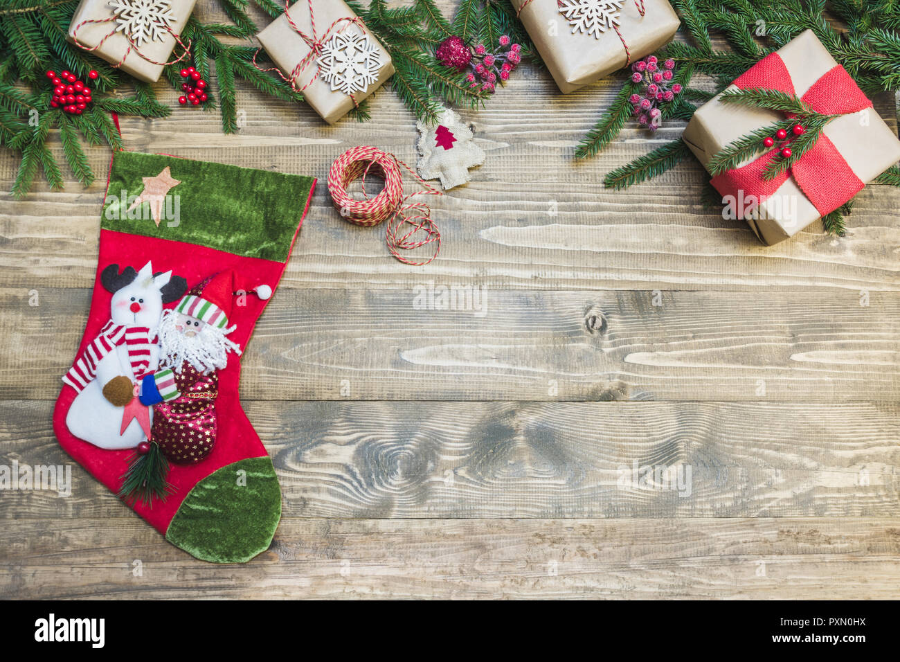 Christmas holiday frame - sock, tree, gifts, holly berries and ...