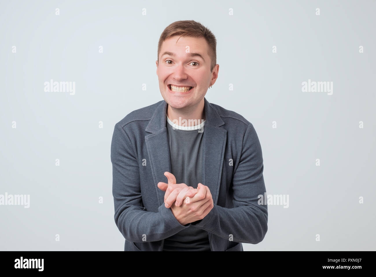 Handsome caucasian man smiling happily and clapping hands surprised ...
