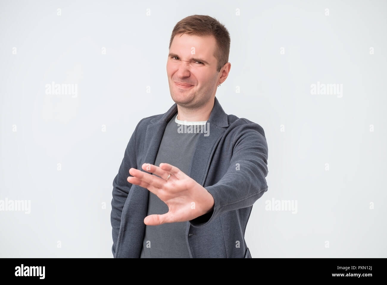 Handsome european man making stop sign refusing from something Stock ...