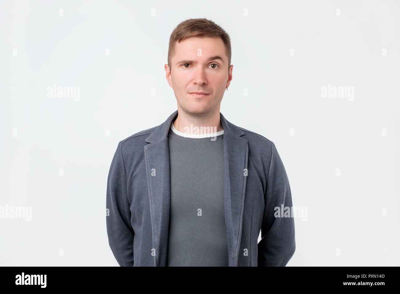 Serious confident man with poker face. Emotion facial expression Stock ...