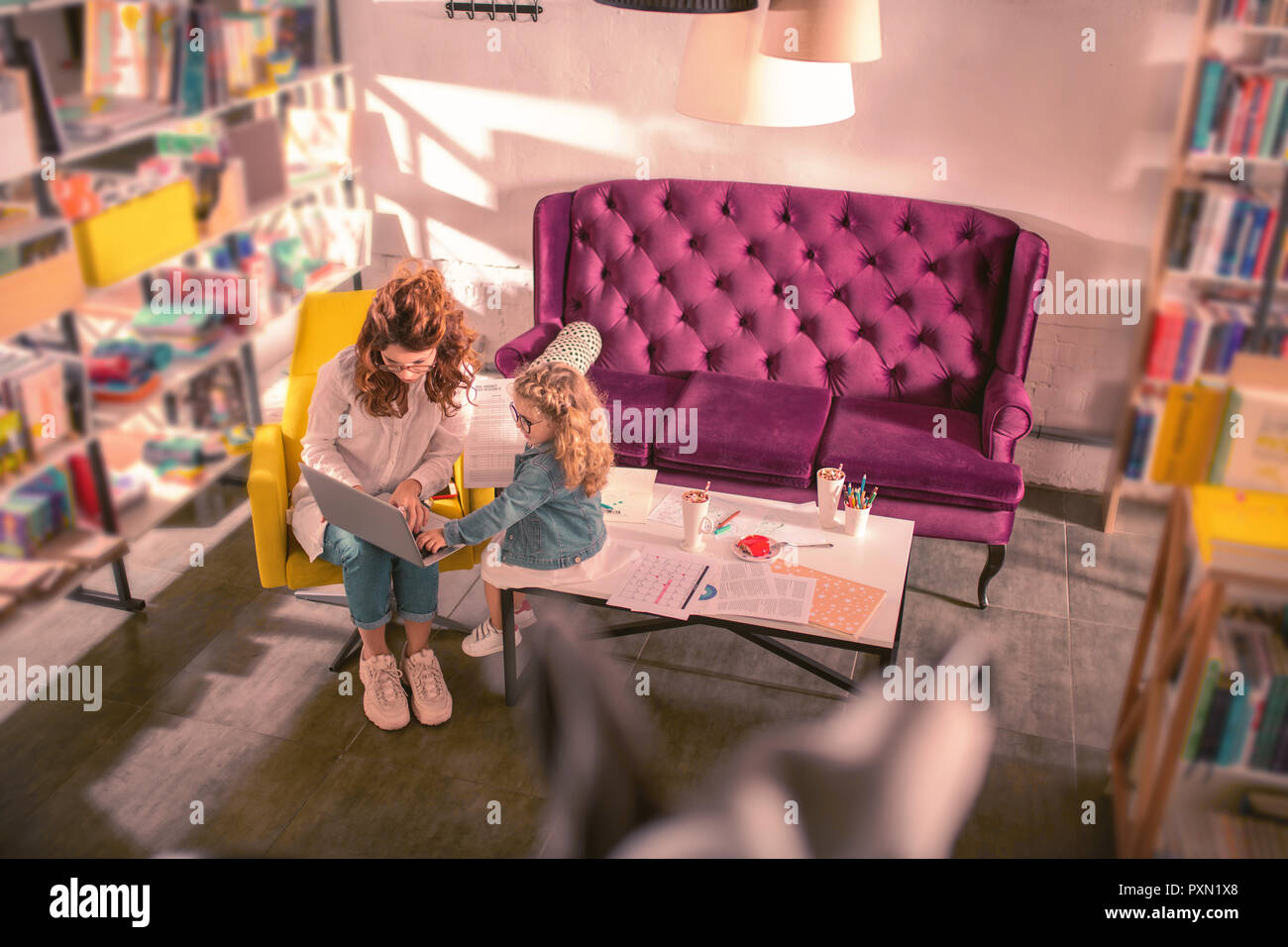 Attentive female person staring at screen of laptop Stock Photo - Alamy