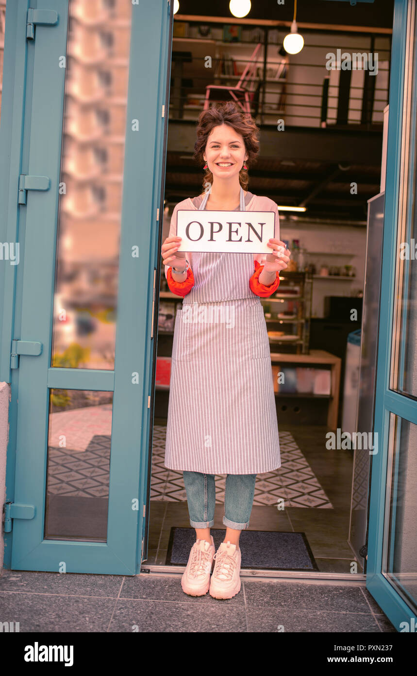 Amazing female person waiting for cafe visitors Stock Photo - Alamy