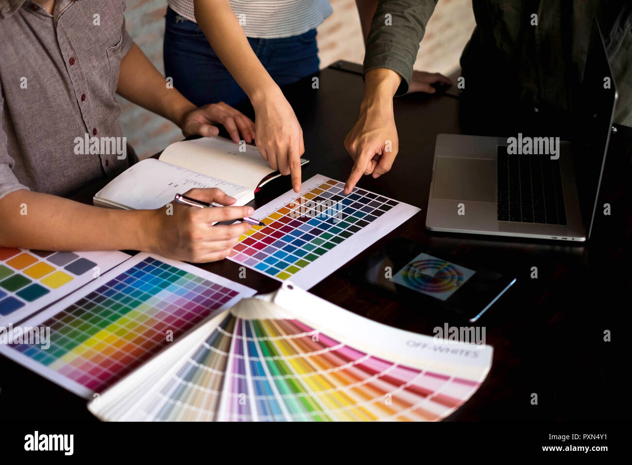 Graphic designers choose colors from the color bands samples for design ...