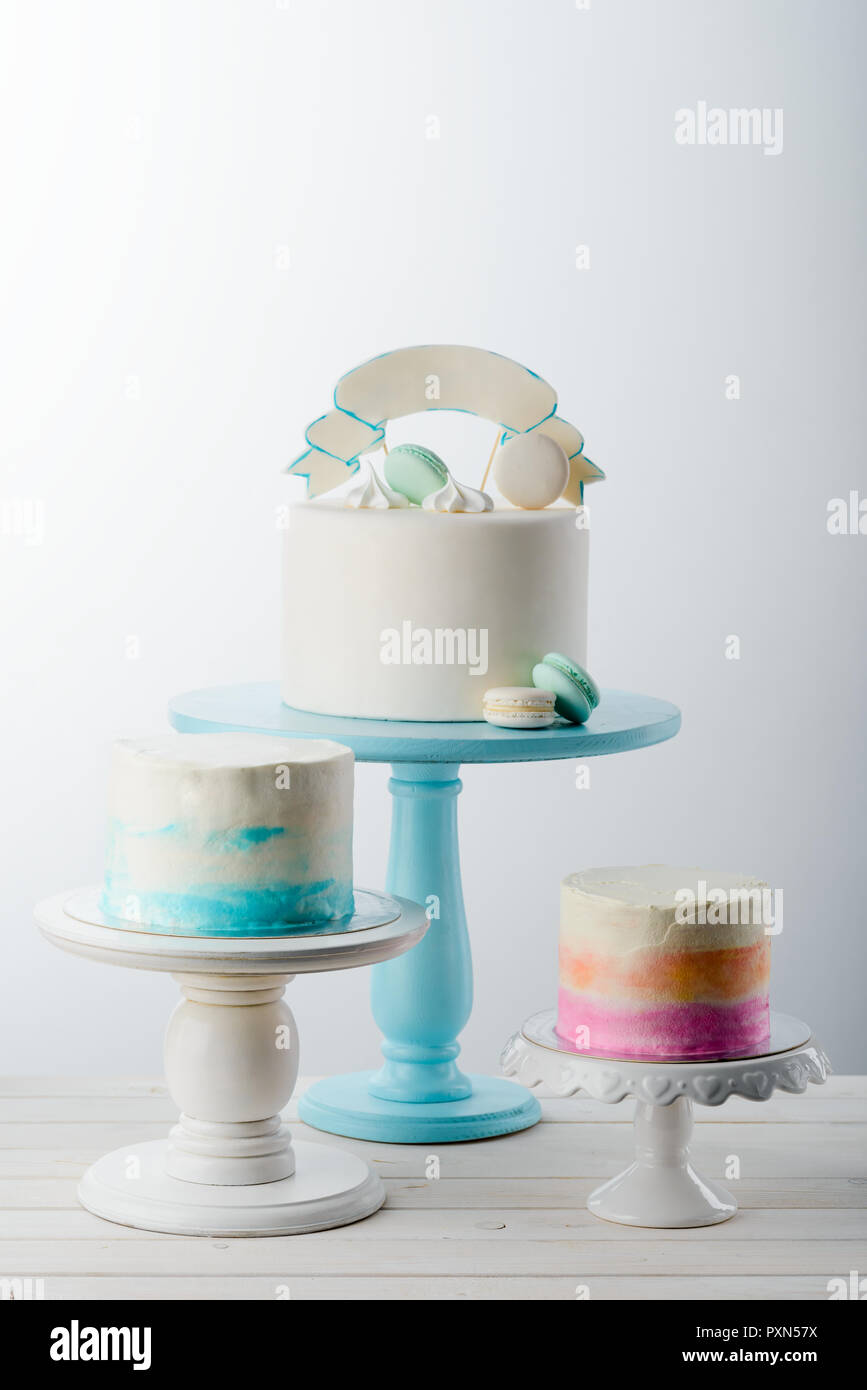 Three cakes on neutral background Stock Photo - Alamy