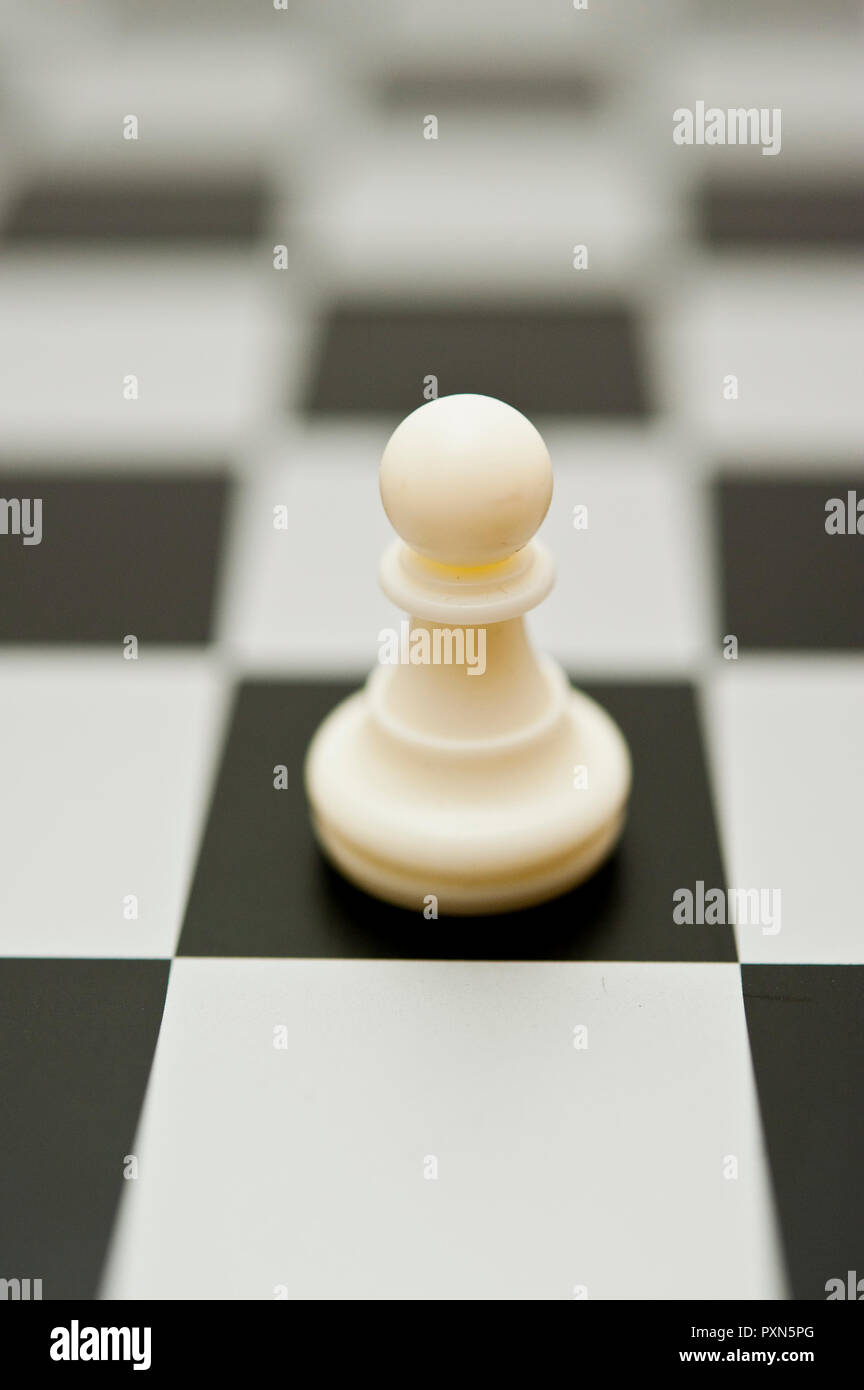 white chess Pawn piece on the chessboard Stock Photo - Alamy